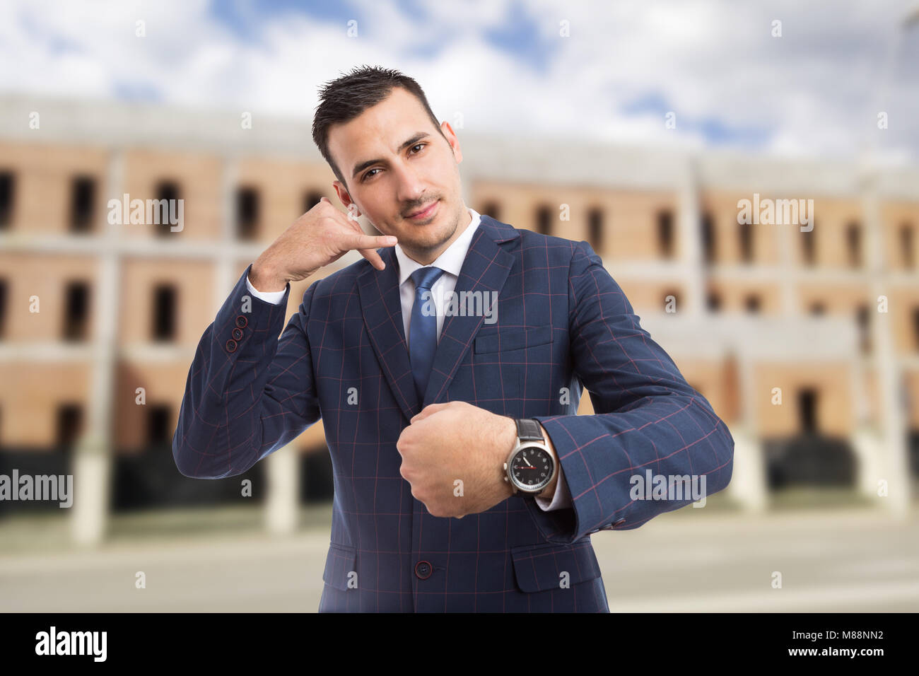 Sales man or realtor making call me you are late for meeting gesture on ...