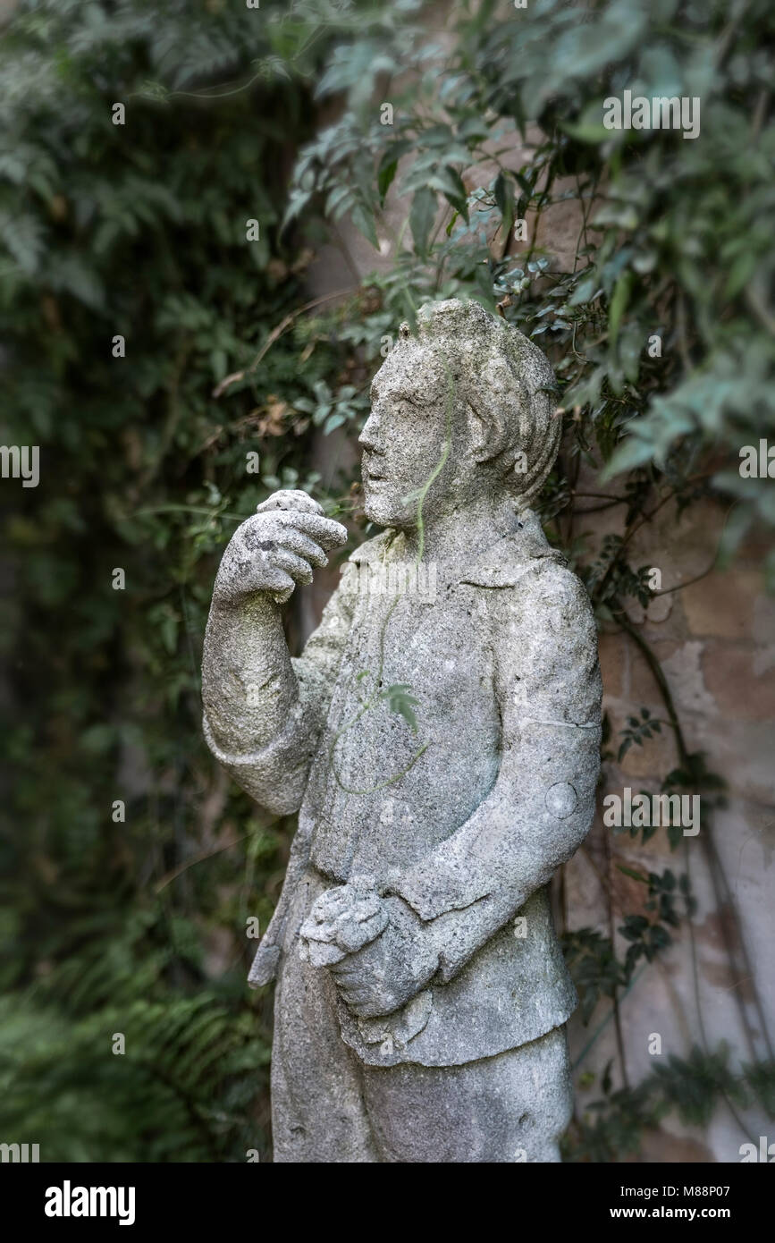 Rustic garden statue Stock Photo - Alamy