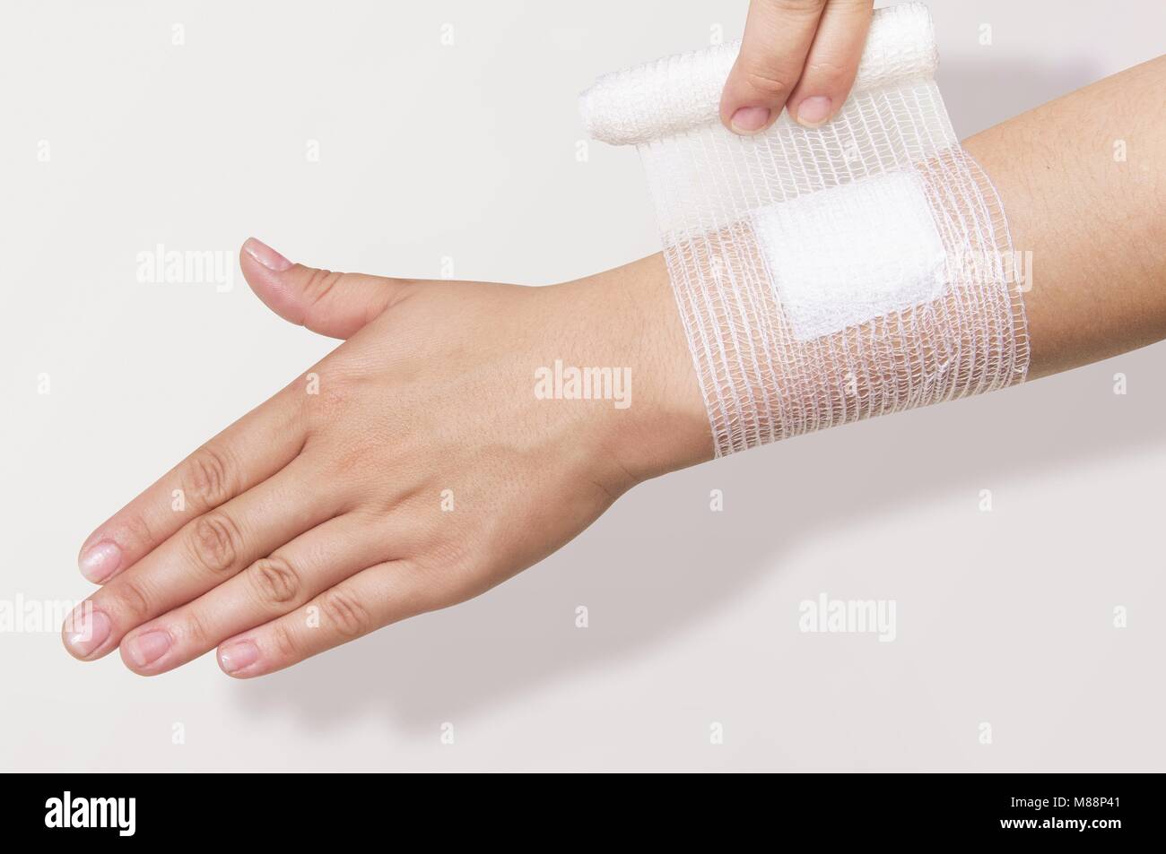 Medicine elastic bandage on human hand Stock Photo - Alamy