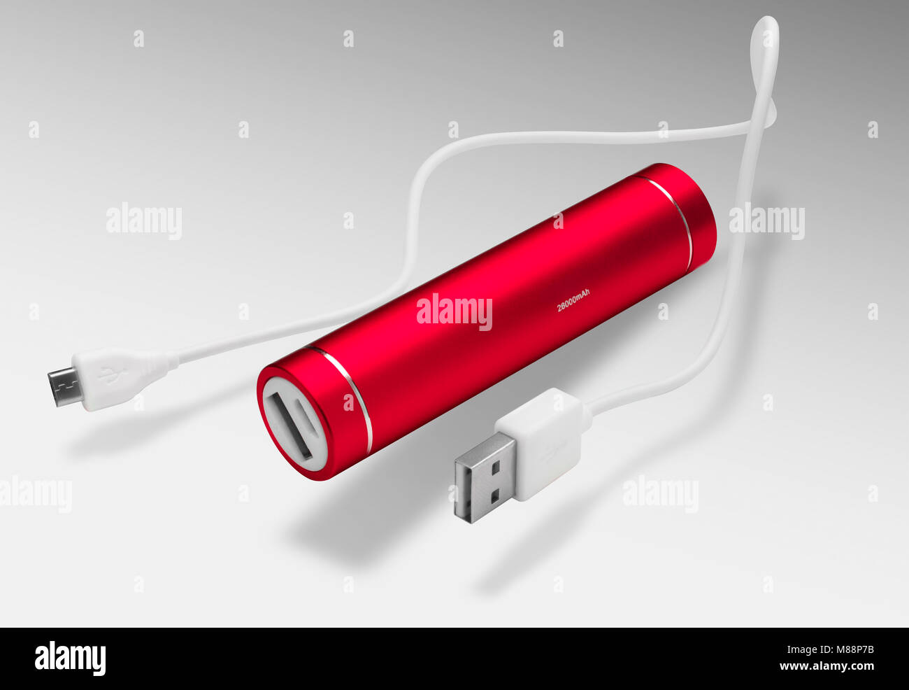 Red Power bank floating at grey background, portable size with usb ...
