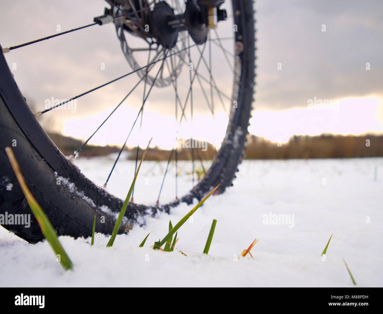 Winter snow riding on mountine bike. Extreme weather, slippery road in ...