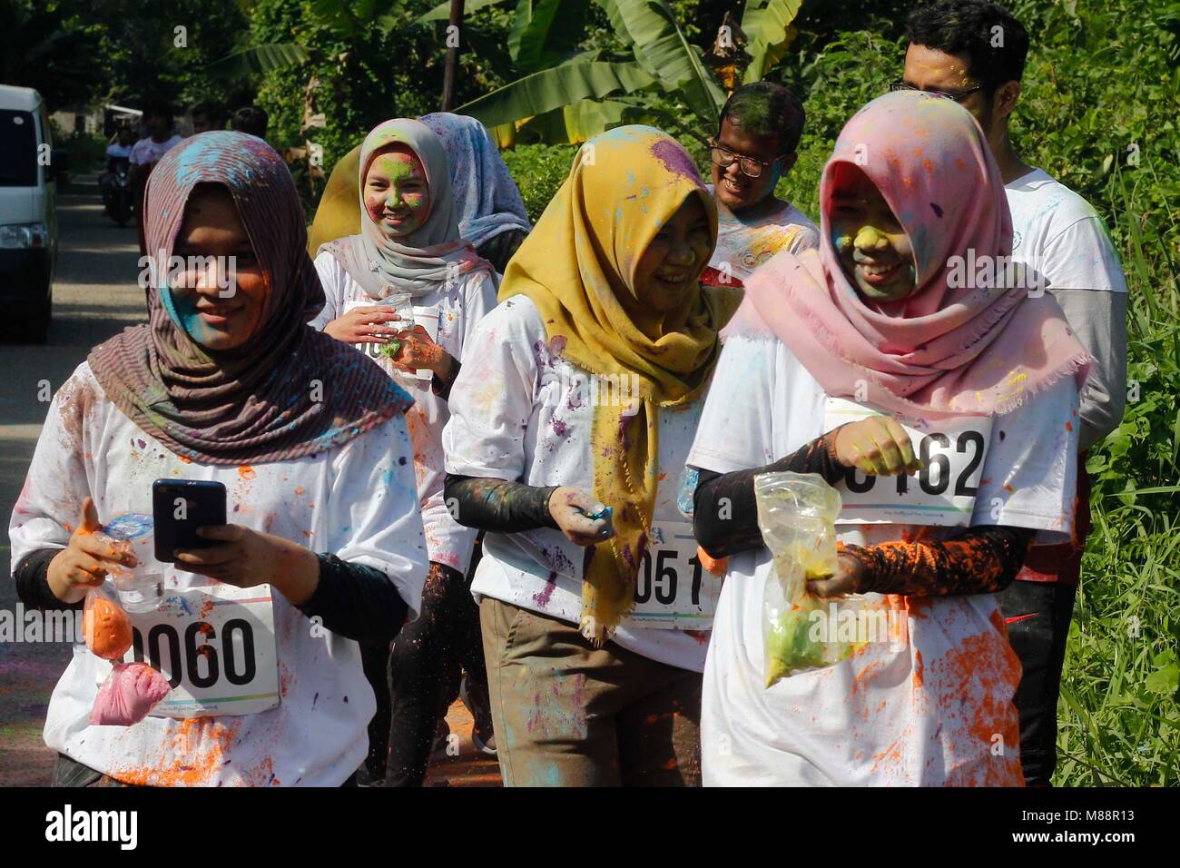 Bogor, Indonesia. 16th Mar, 2018. Participants with their faces and ...