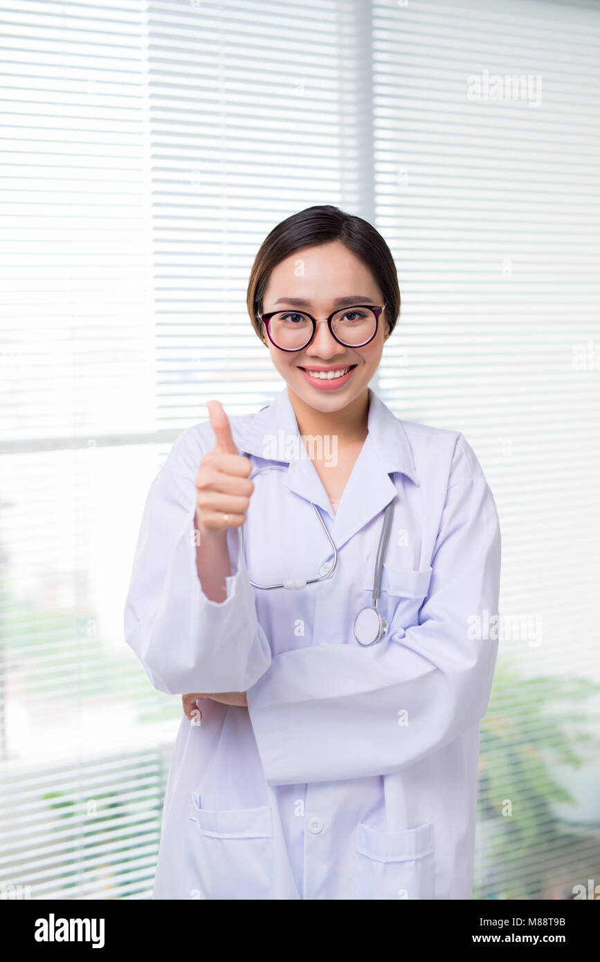 Female doctor hands with thumbs up gesture Stock Photo - Alamy