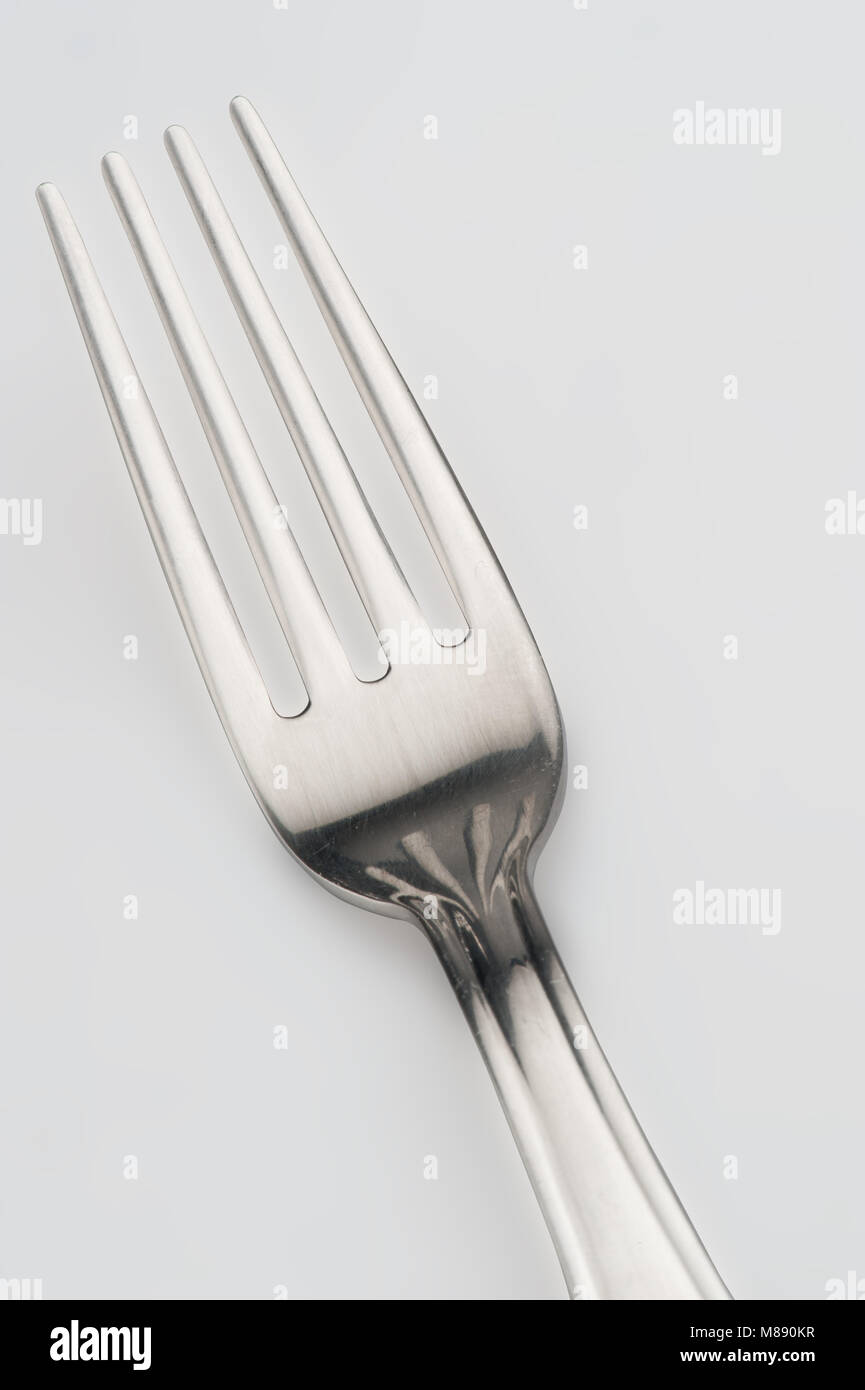 Fork on white background Stock Photo - Alamy