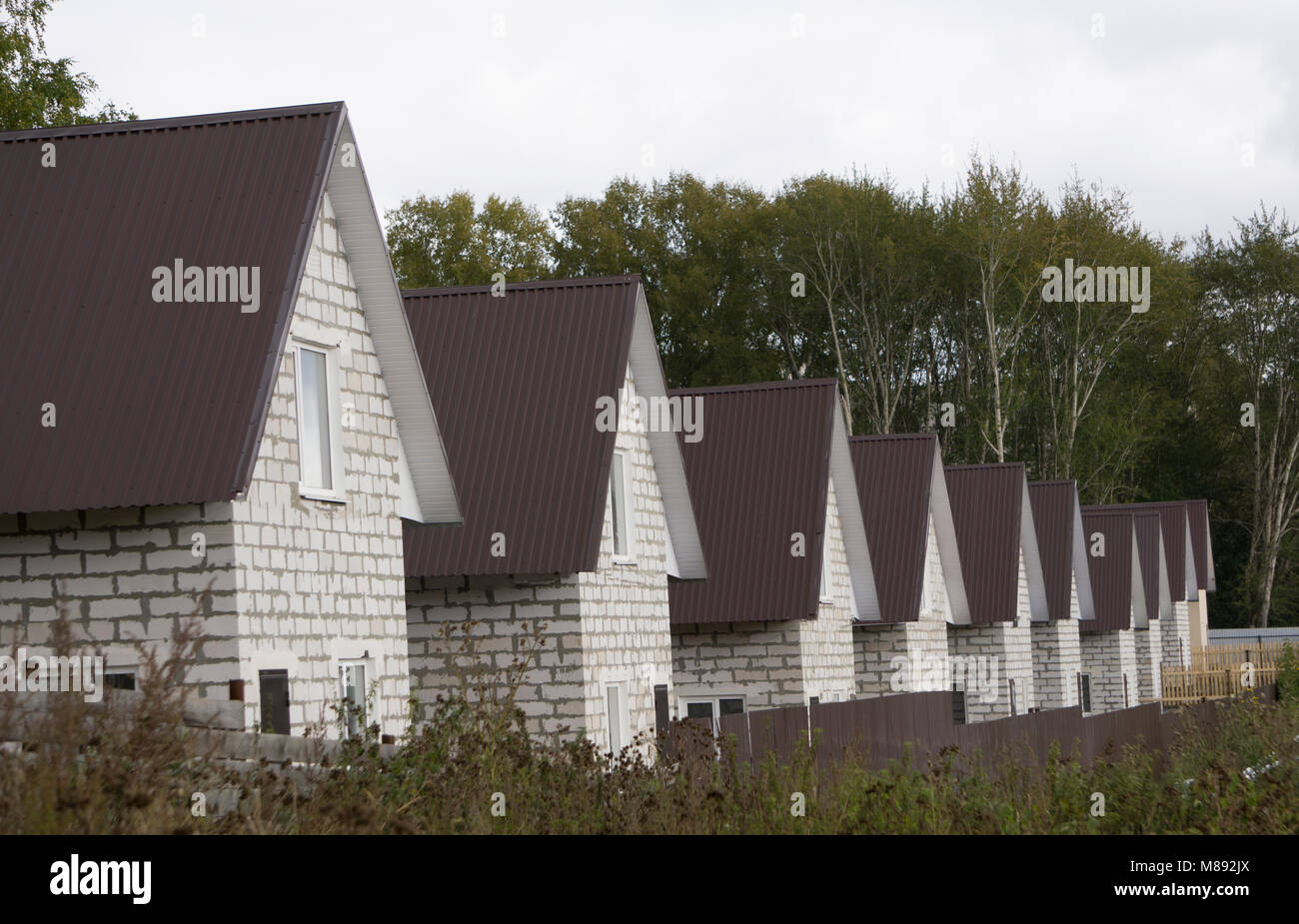 Residential area with newly built houses in a row Stock Photo - Alamy