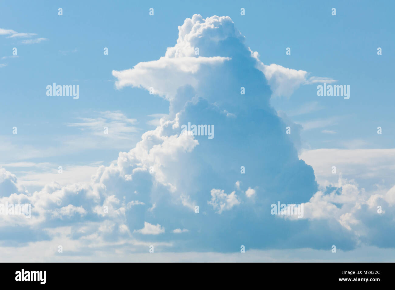 Huge cloud in the sky transforms in interesting shapes Stock Photo - Alamy