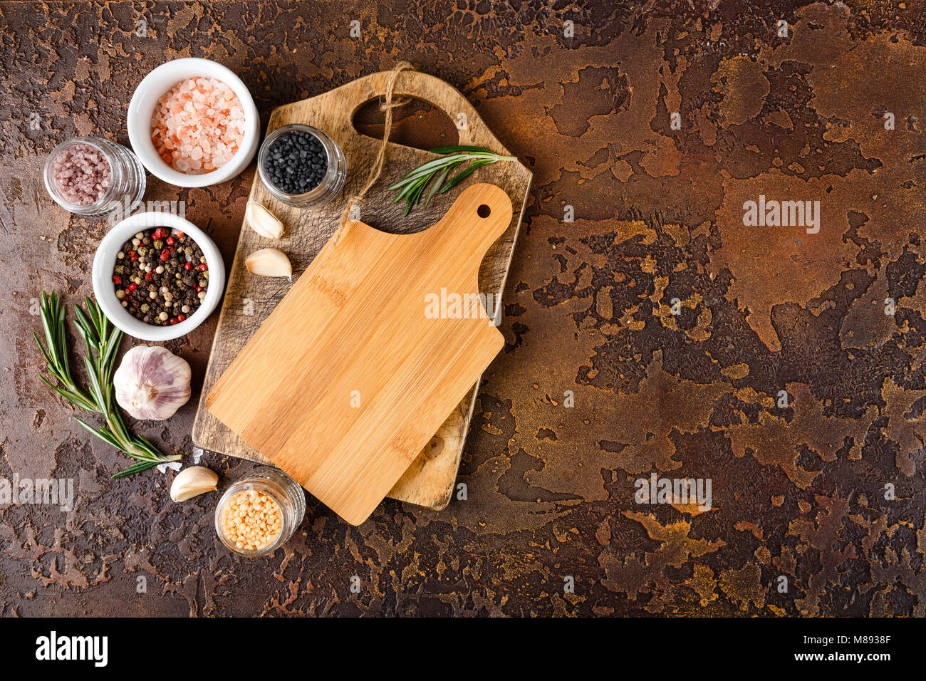 Cooking table with herbs, spices and utensils. Top view with copy space ...