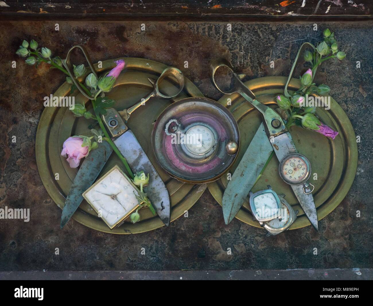 Two pairs of open scissors with rusty blades on copper plates ...