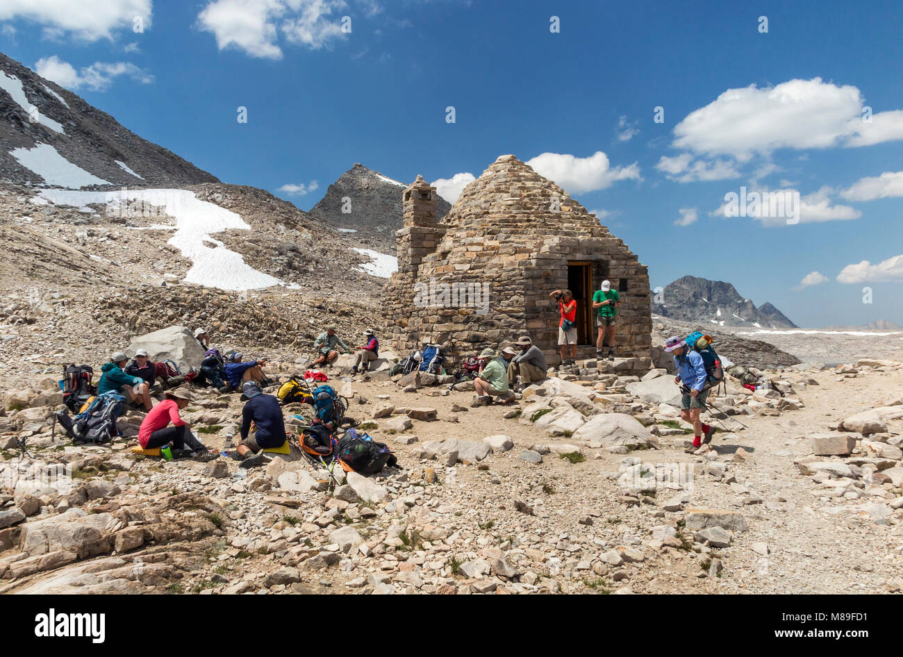 CA03384-00...CALIFORNIA - Hikers gather at the stone hut on Muir Pass ...