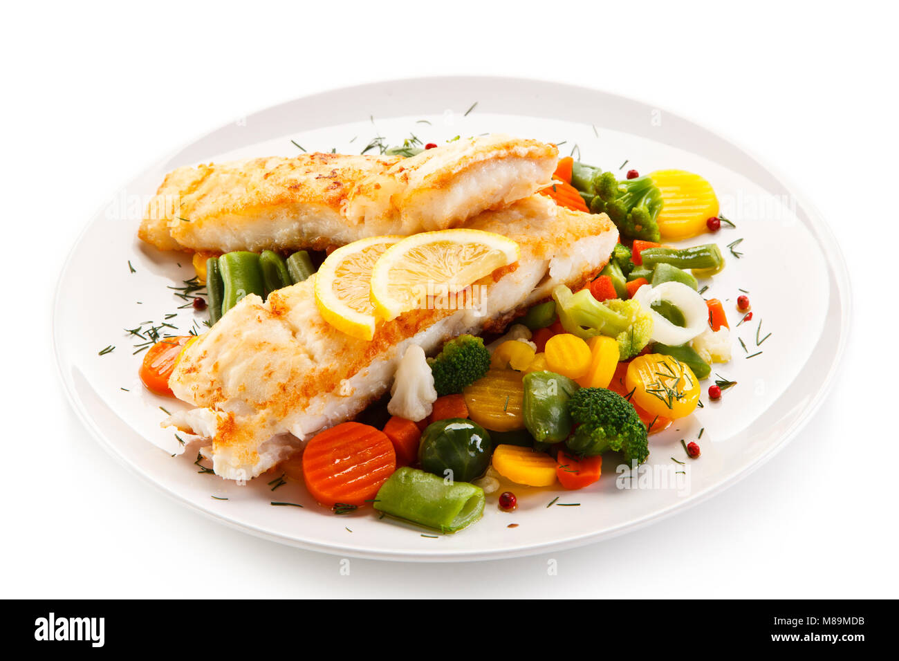 Fish dish - fried fish fillet and vegetables Stock Photo - Alamy