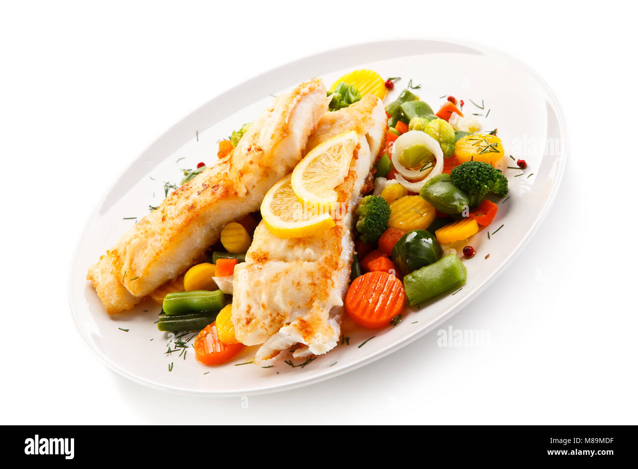 Fish dish - fried fish fillet and vegetables Stock Photo - Alamy