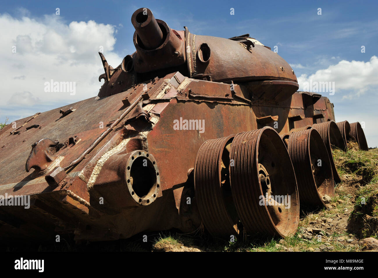 Old, ancient metal tank with a short round barrel and a small cabin on ...