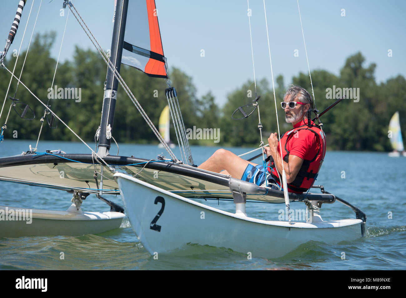 man sailing on a lake Stock Photo - Alamy