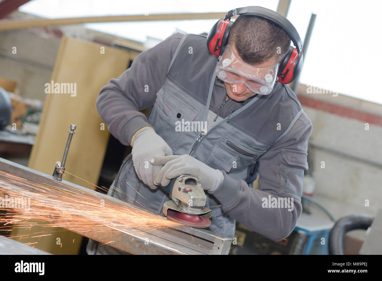 a man working with grinder Stock Photo - Alamy
