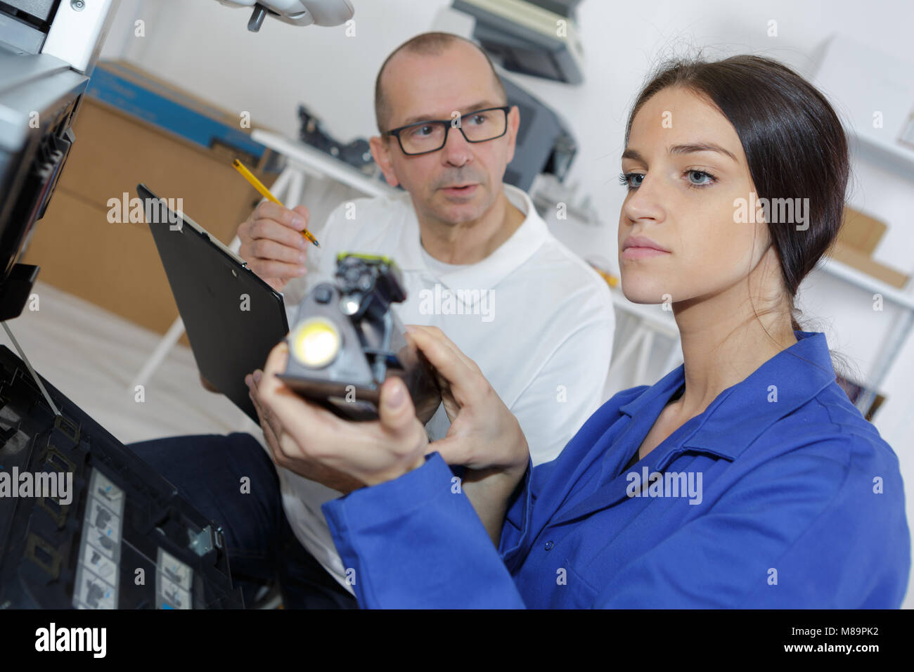 female apprentice with teacher Stock Photo - Alamy