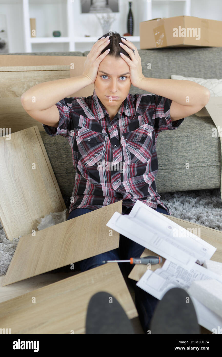 Woman girl assembling furniture hi-res stock photography and images - Alamy