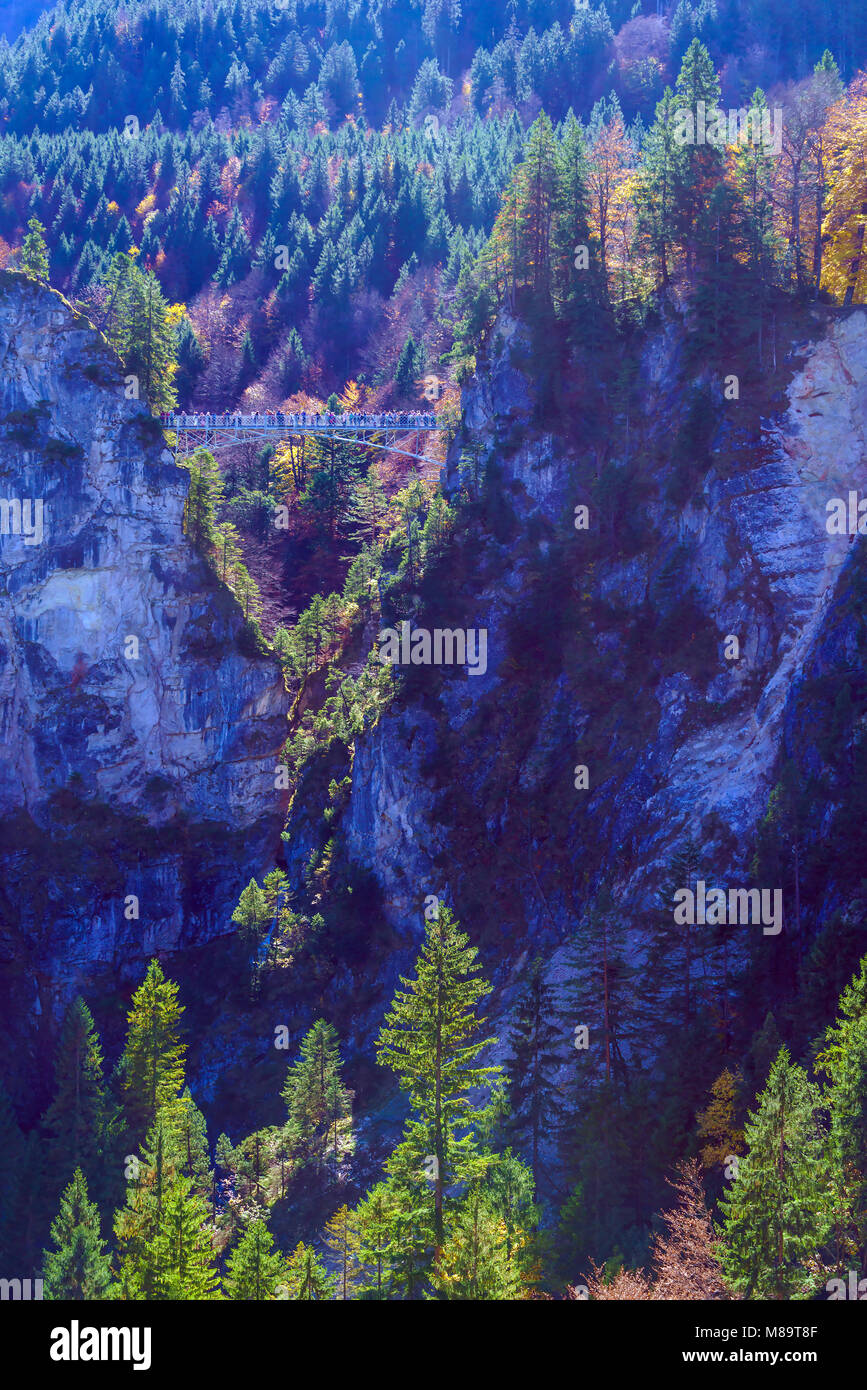 Tourists stand on Marienbruecke (Marie's Bridge) near Neuschwanstein ...