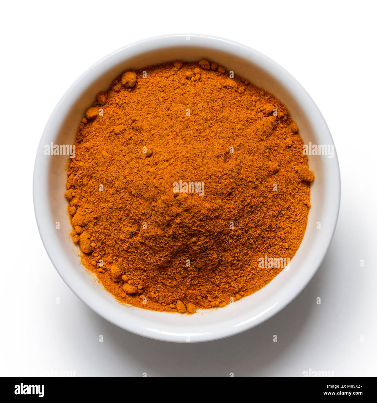 Ground saffron in white ceramic bowl isolated on white from above Stock ...