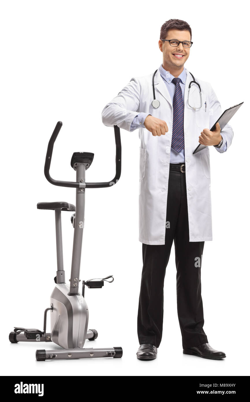 Full length portrait of a doctor with a clipboard leaning on an ...