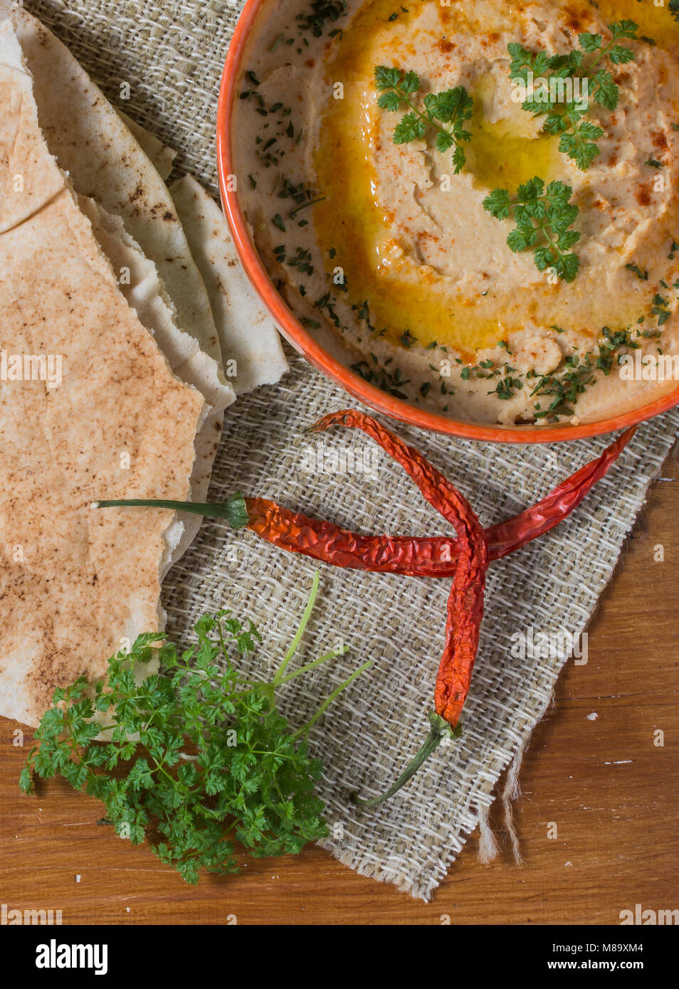 Traditional hummus salad on rustic wooden table Stock Photo - Alamy