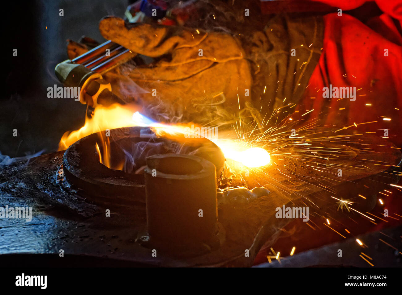Close up of manual gas gouging of carbon steel with acetylene and ...