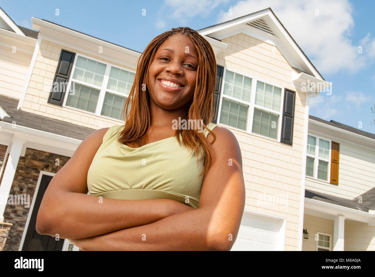 A young African American woman at her newly purchased home Stock Photo ...