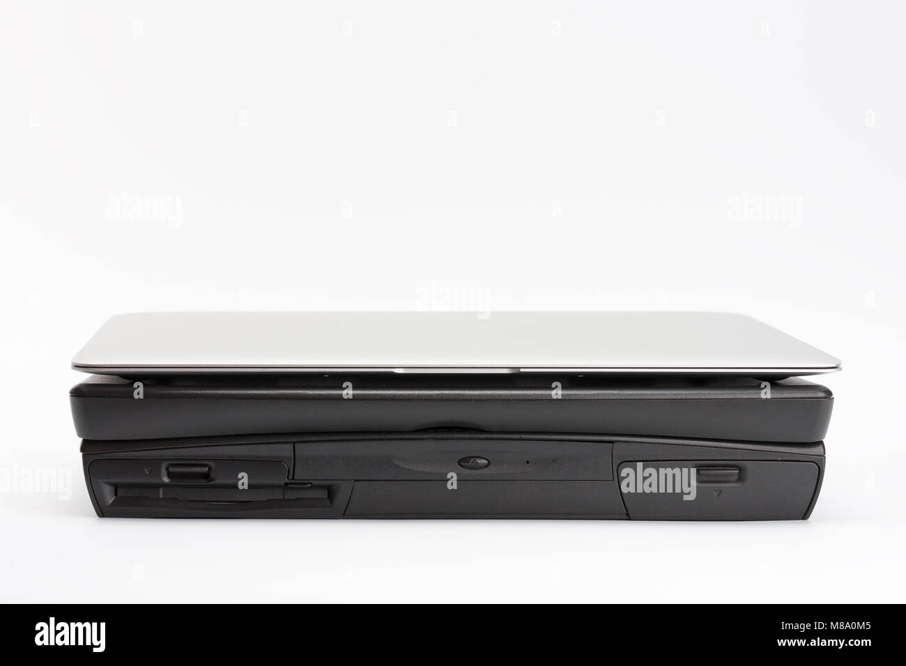 Comparing of laptops, new modern and old laptop, present and past ...