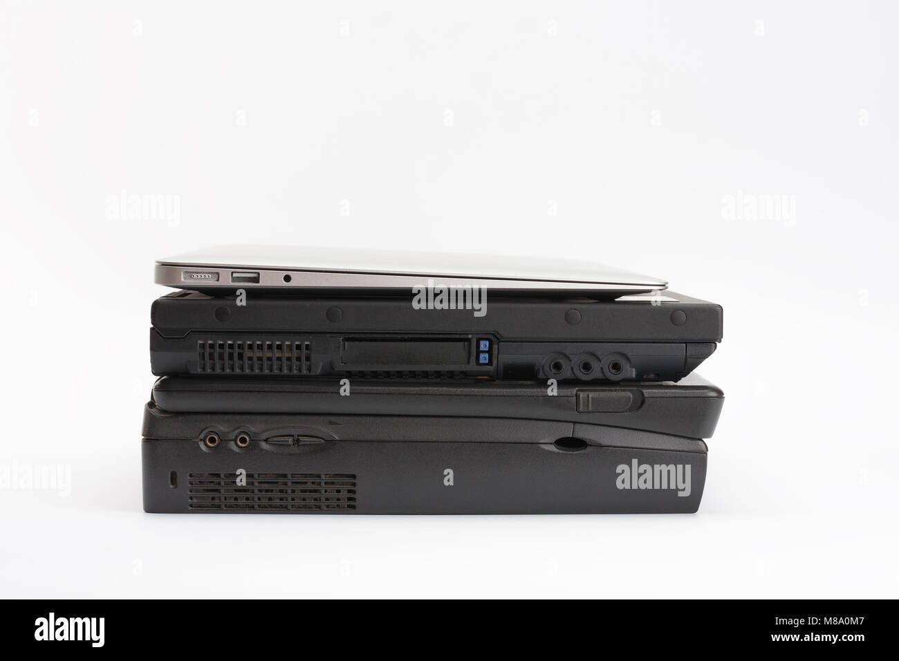 Comparing of laptops, new modern and old laptops, present and past ...