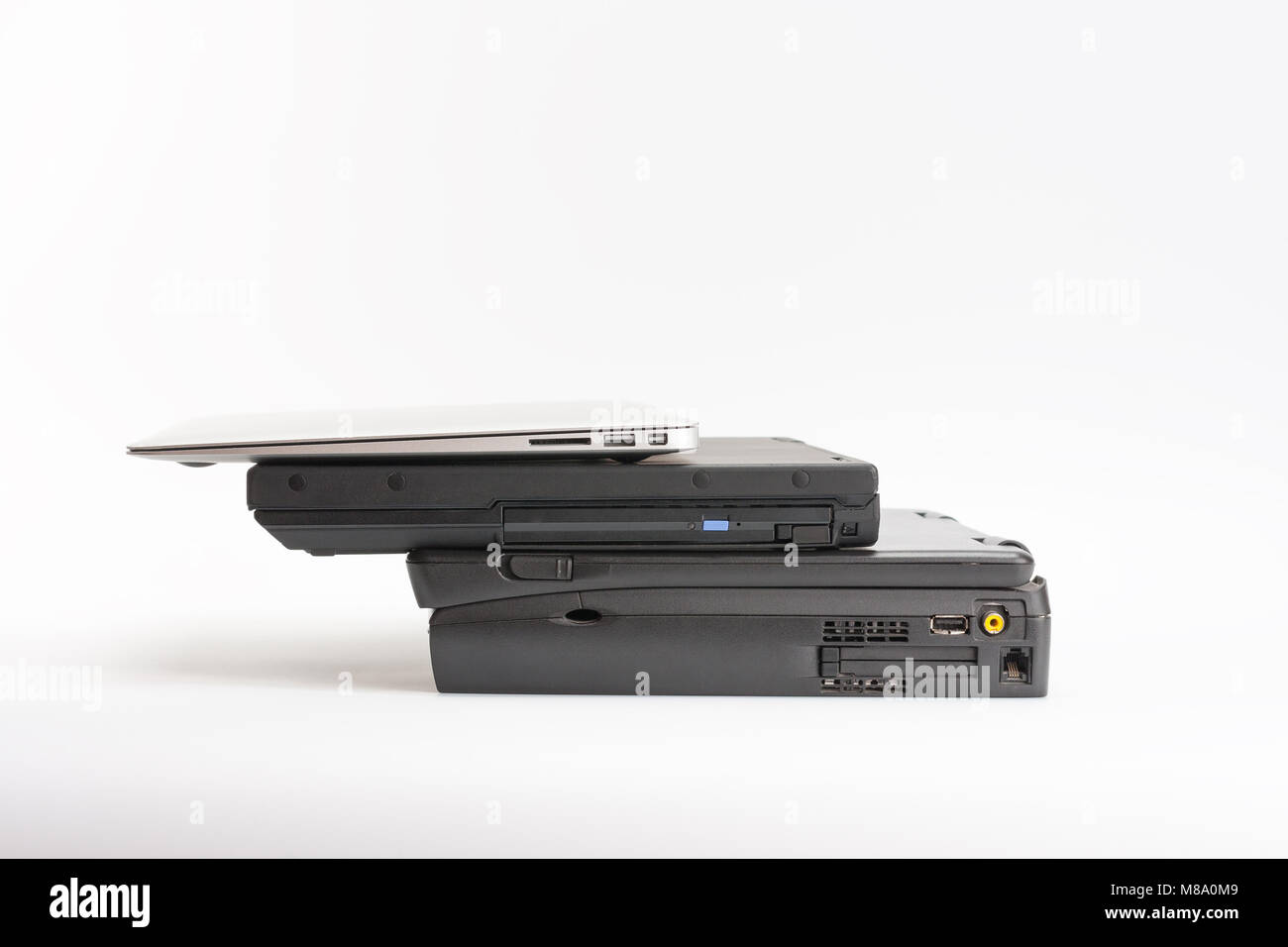 Comparing of laptops, new modern and old laptops, present and past ...