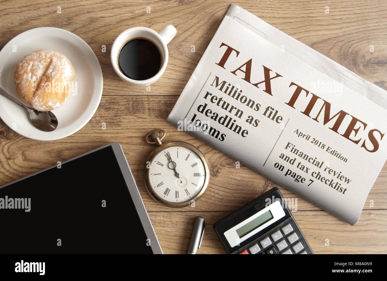 Tax times mock up newspaper with clock, calculator and tablet Stock ...