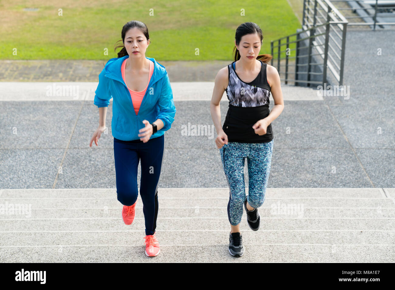 Healthy fitness woman in sportswear jogging and running outdoors in ...