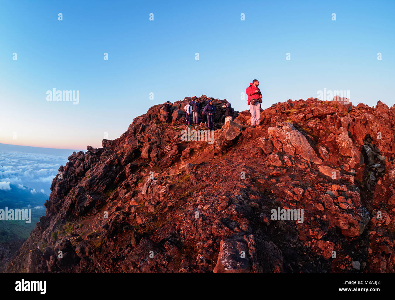 People on top of the Mount Pico at sunrise, Pico Island, Azores ...