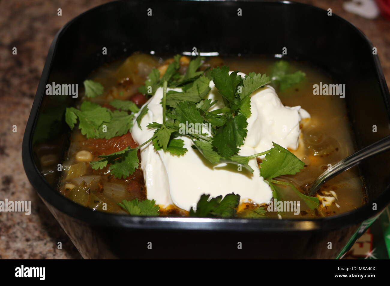 Fresh hot South American Aztec soup with cream Stock Photo - Alamy