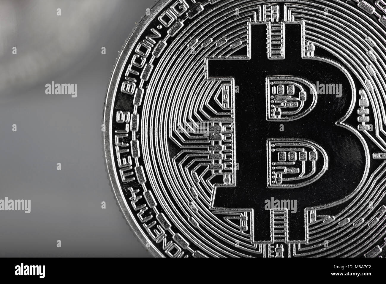 Closeup of digital asset -bitcoin. Gray background Stock Photo - Alamy