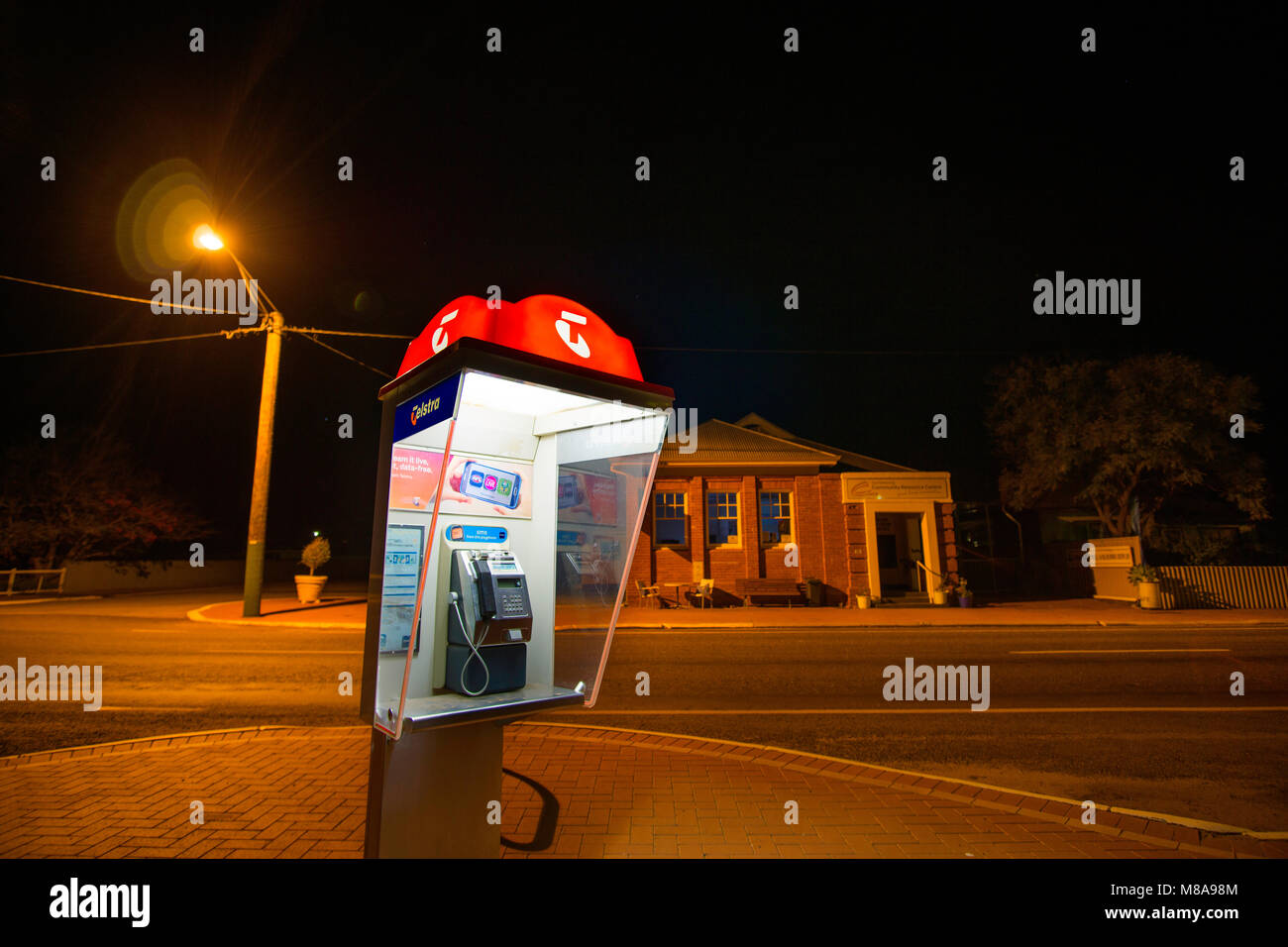 Phone booth in small country town at night Stock Photo - Alamy