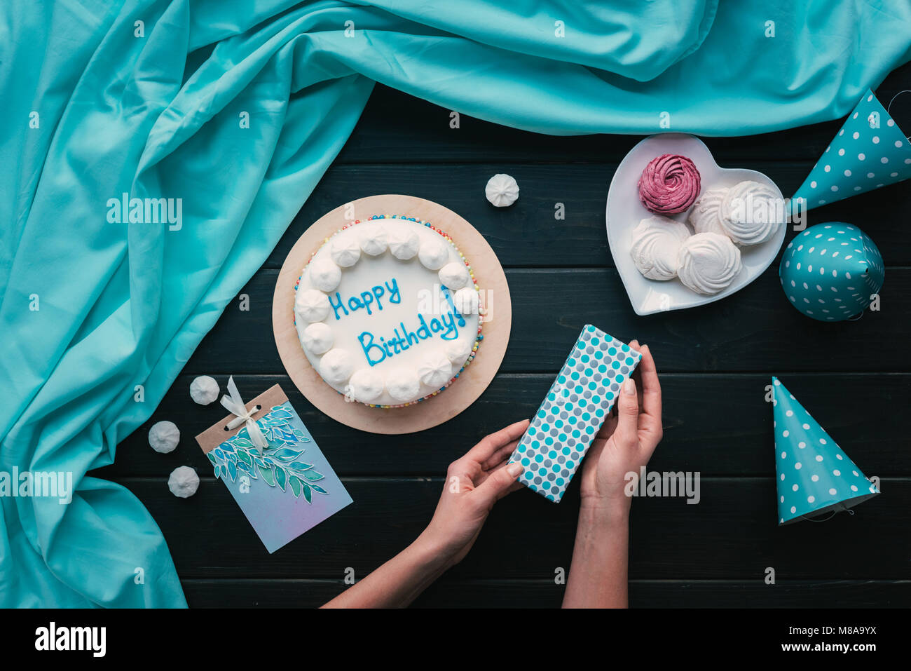 woman putting present on table Stock Photo - Alamy