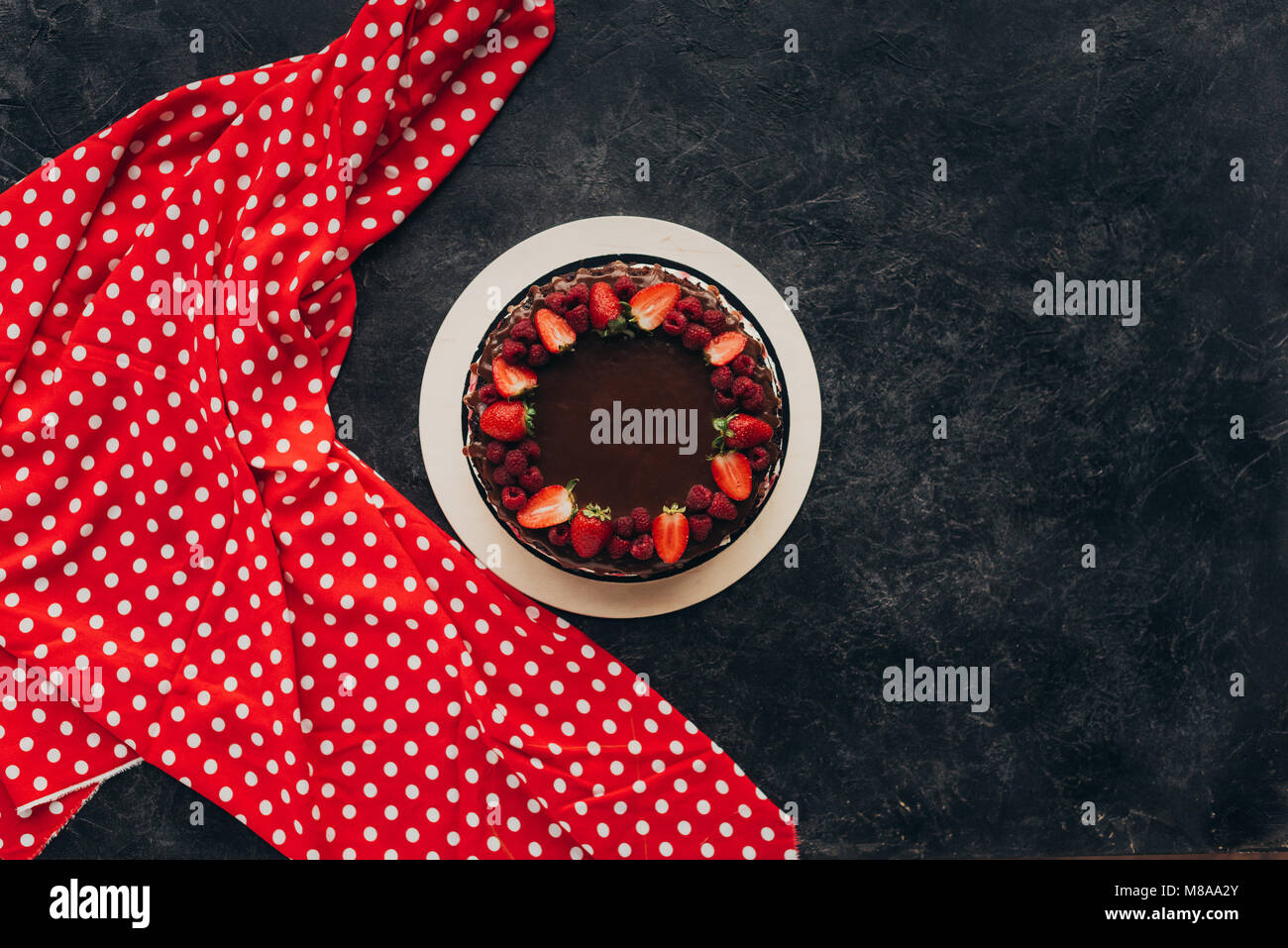 chocolate cake with red tablecloth Stock Photo - Alamy