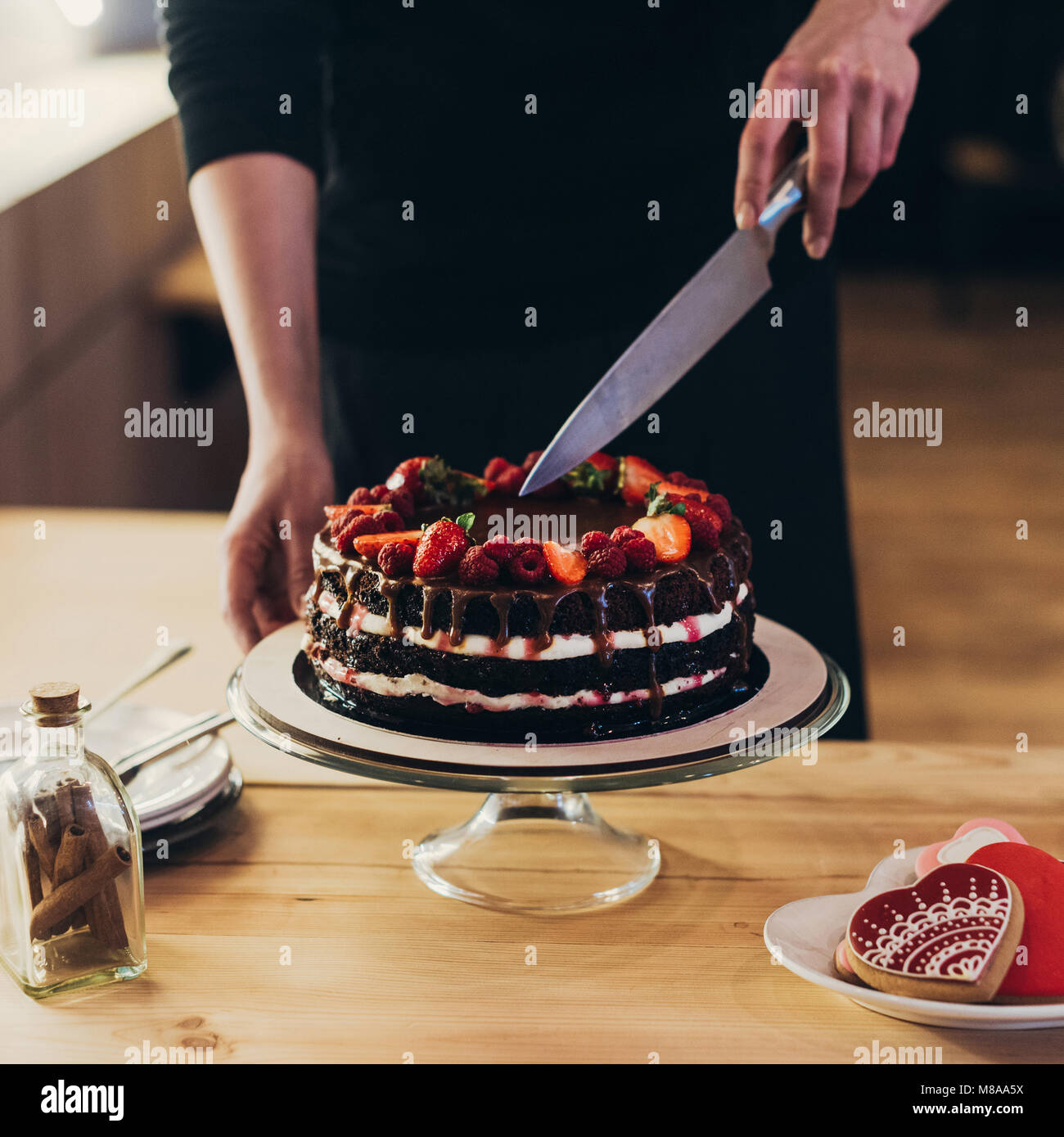 Woman bake cake heart hi-res stock photography and images - Alamy