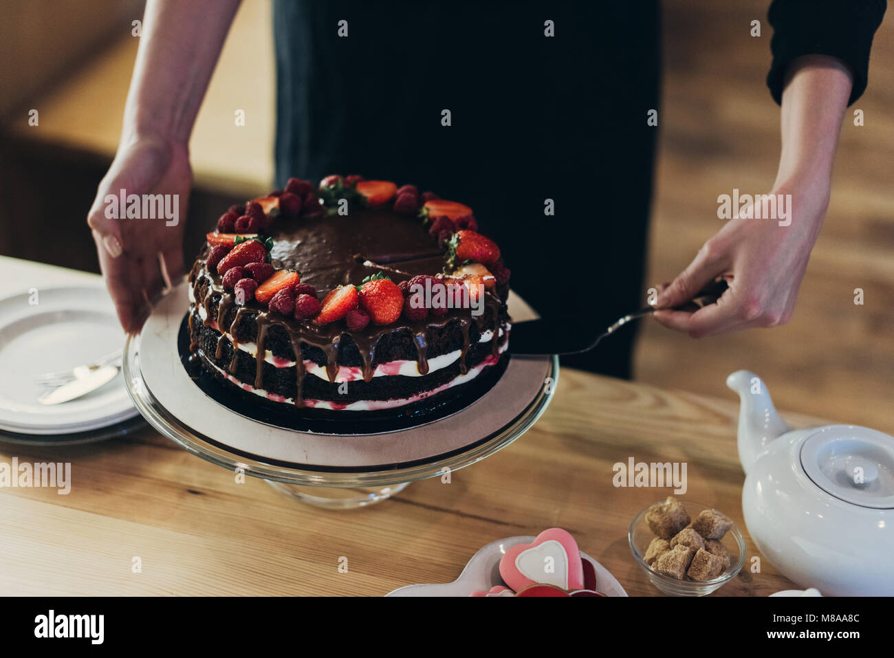woman taking piece of cake Stock Photo - Alamy