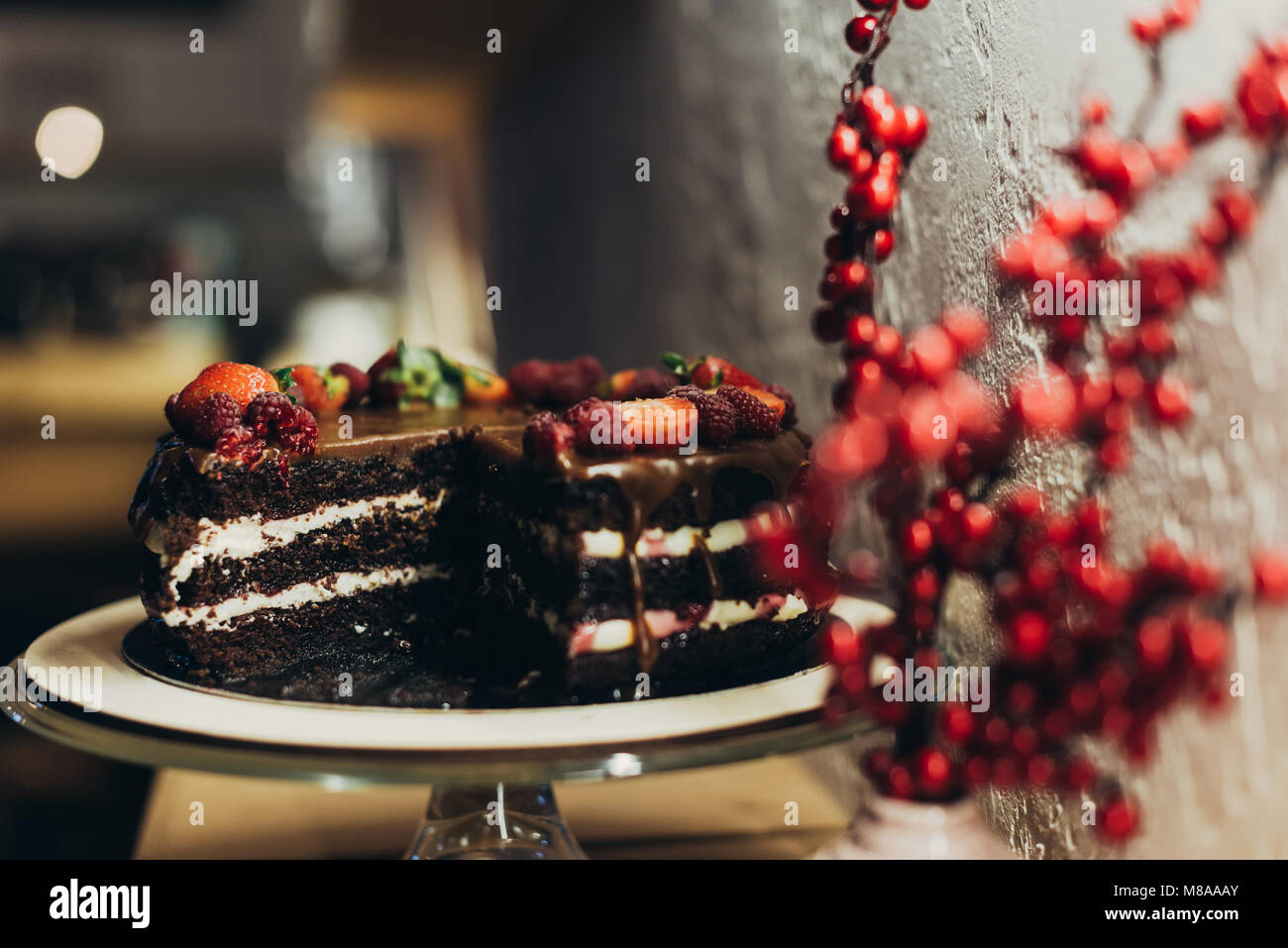 Chocolate cake on cake stand Stock Photo - Alamy