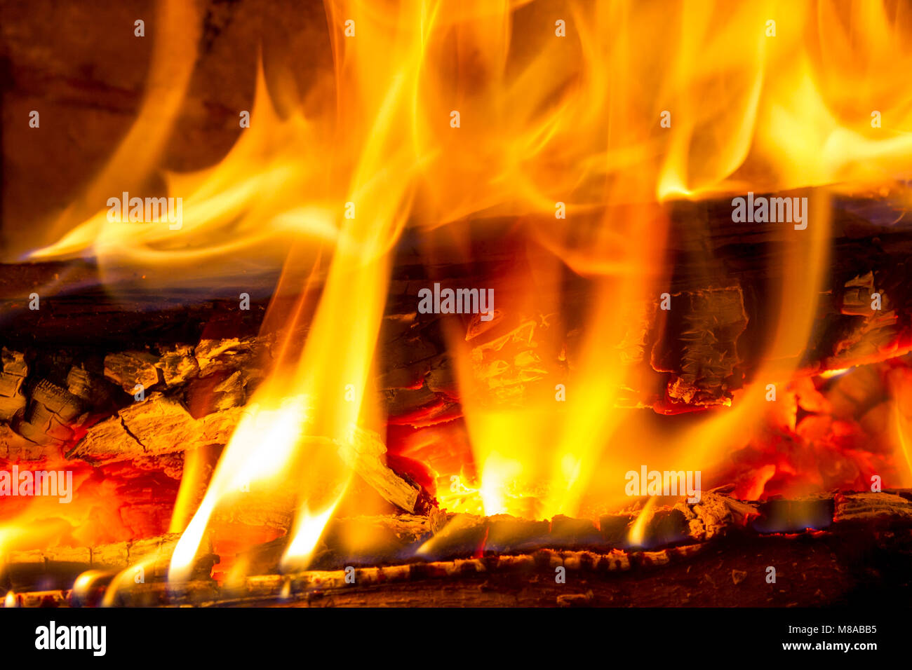Log fire in a fireplace Stock Photo - Alamy