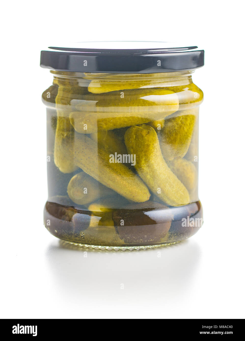 Pickles in jar. Preserved cucumbers isolated on white background Stock ...