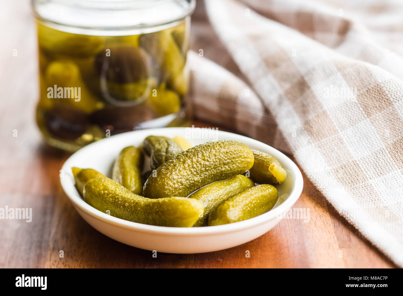 Pickles. Preserved cucumbers in bowl Stock Photo - Alamy
