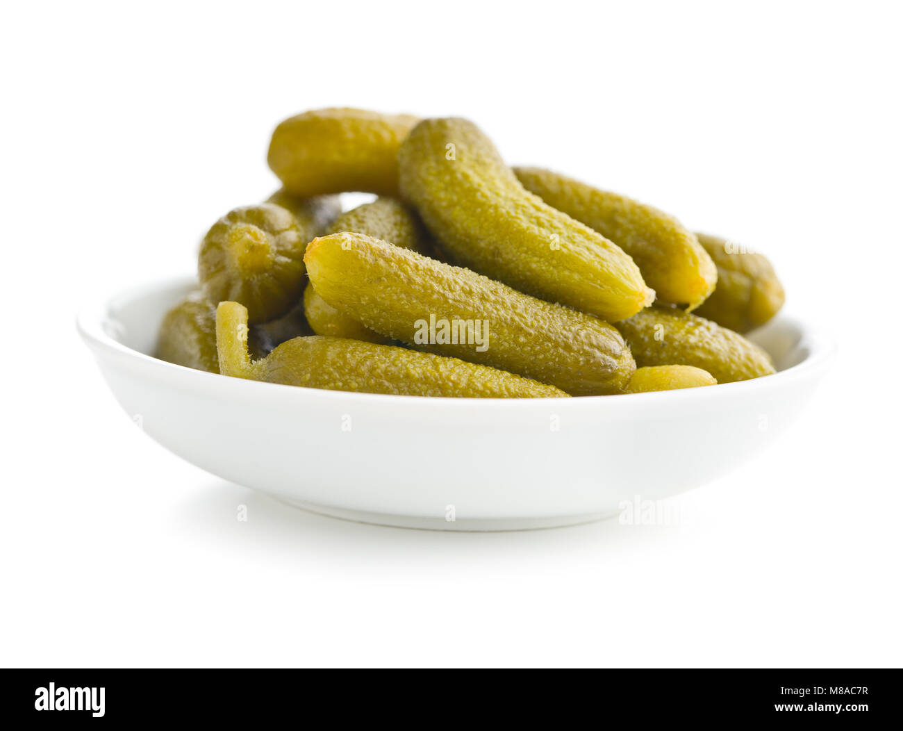 Pickles. Preserved cucumbers in bowl isolated on white background Stock ...