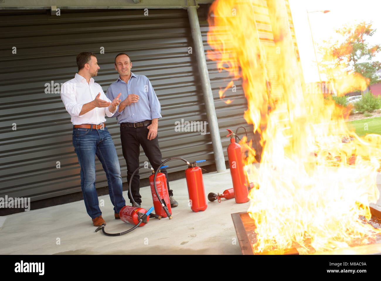 fire extinguisher demonstration Stock Photo - Alamy