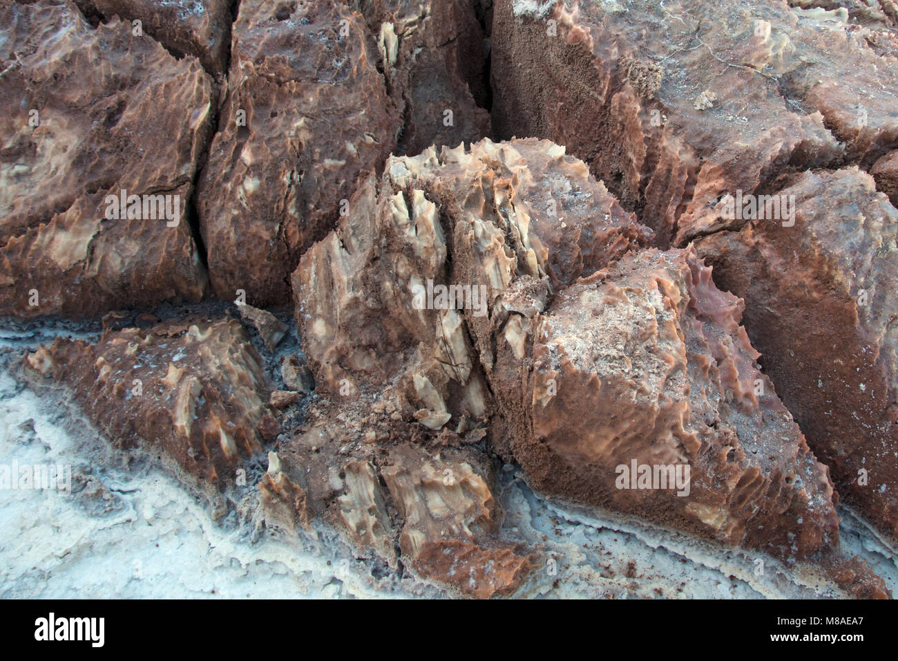 Abstract background of pink salt deposits and white desert land of ...