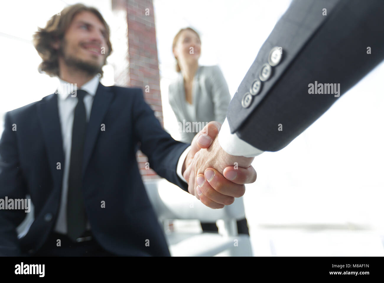 Closeup of a business hand shake Stock Photo - Alamy