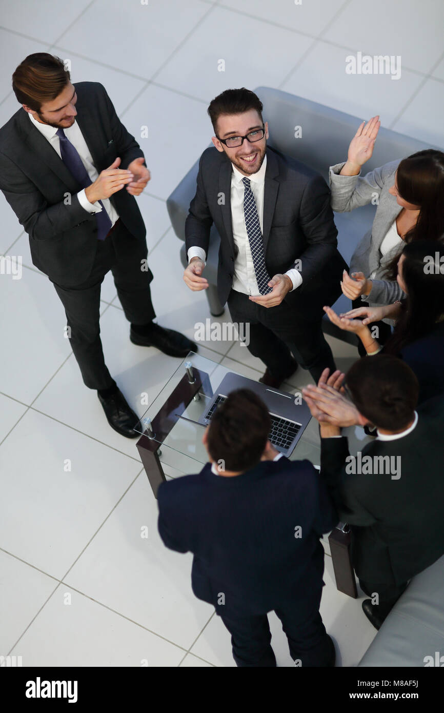 Happy successful business team giving a high fives gesture as th Stock ...