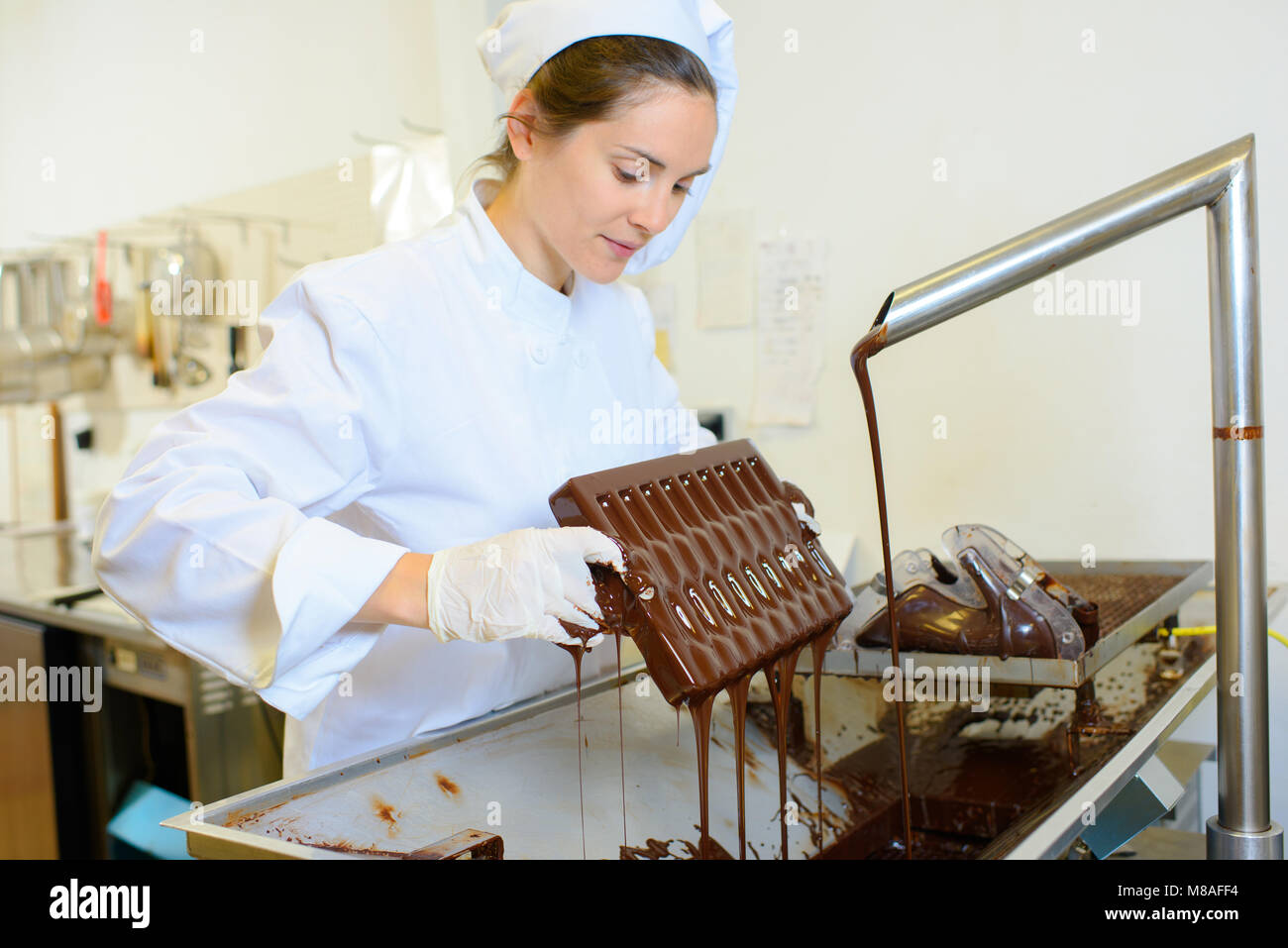 Chocolate maker at work Stock Photo - Alamy