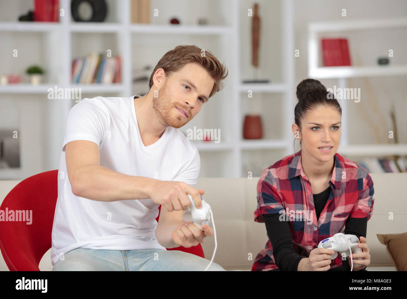 Playing racing videogame hi-res stock photography and images - Alamy